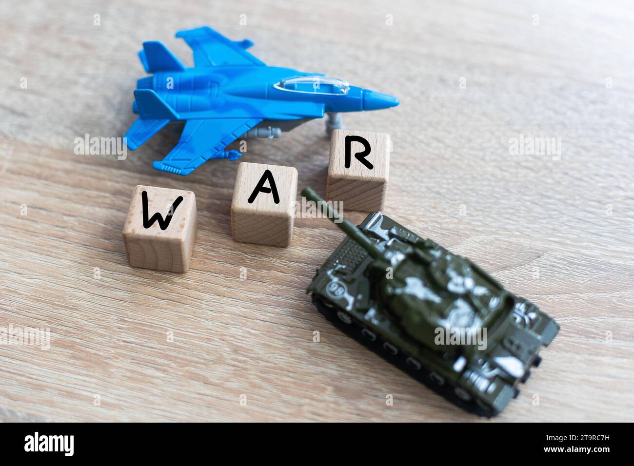 The image shows models of tanks and fighter jets on a white background ...