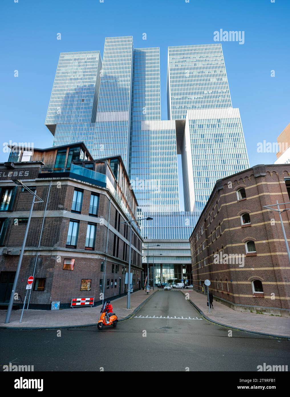 rotterdam, netherlands, 25 november 2023: moped near older buildings ...