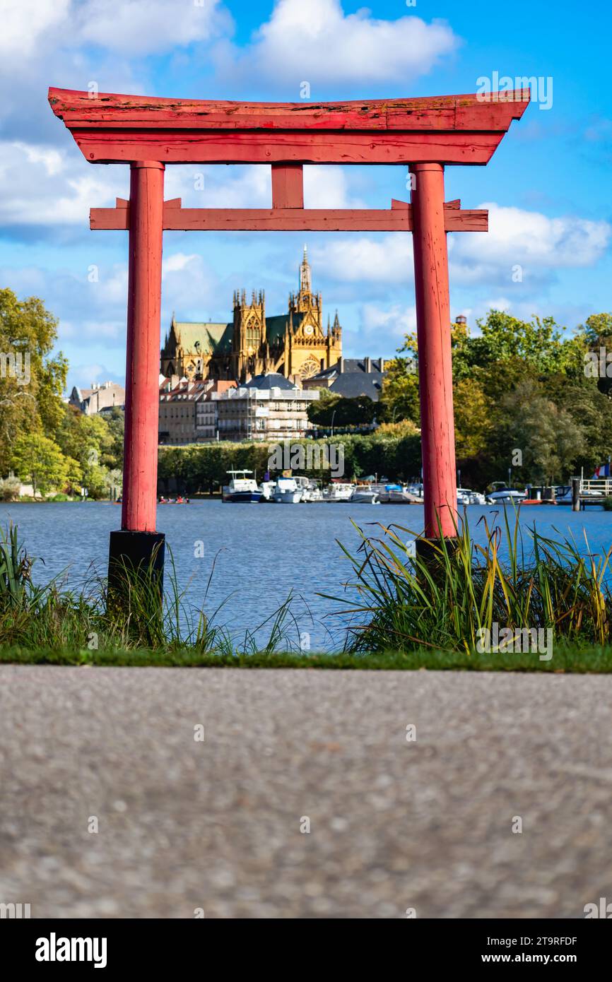 Japanese Torii gate in Metz at the plan d’eau with the Saint Stephen ...
