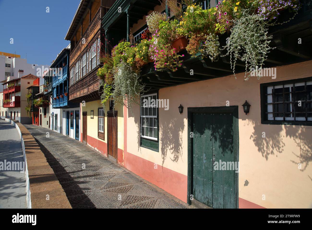 Traditional and colorful houses with wooden balconies located along ...