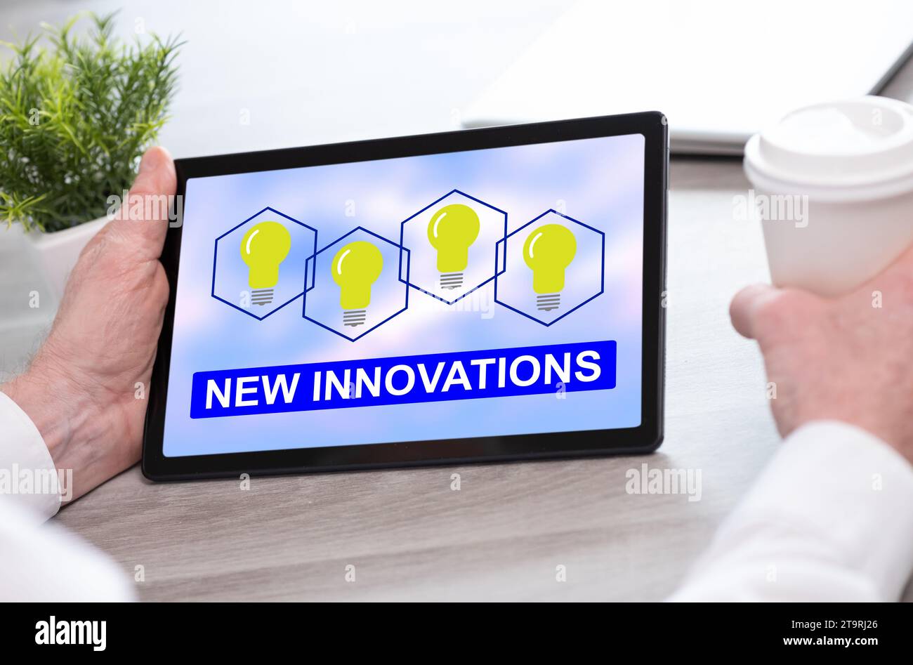 Tablet screen displaying a new innovations concept Stock Photo - Alamy