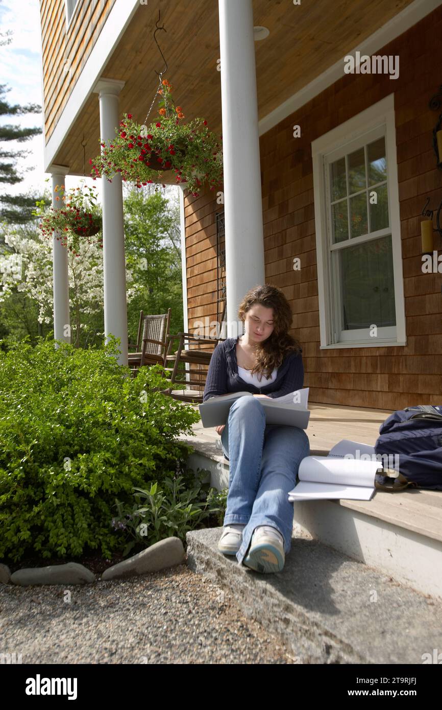 A student sitting outside, studying Stock Photo - Alamy