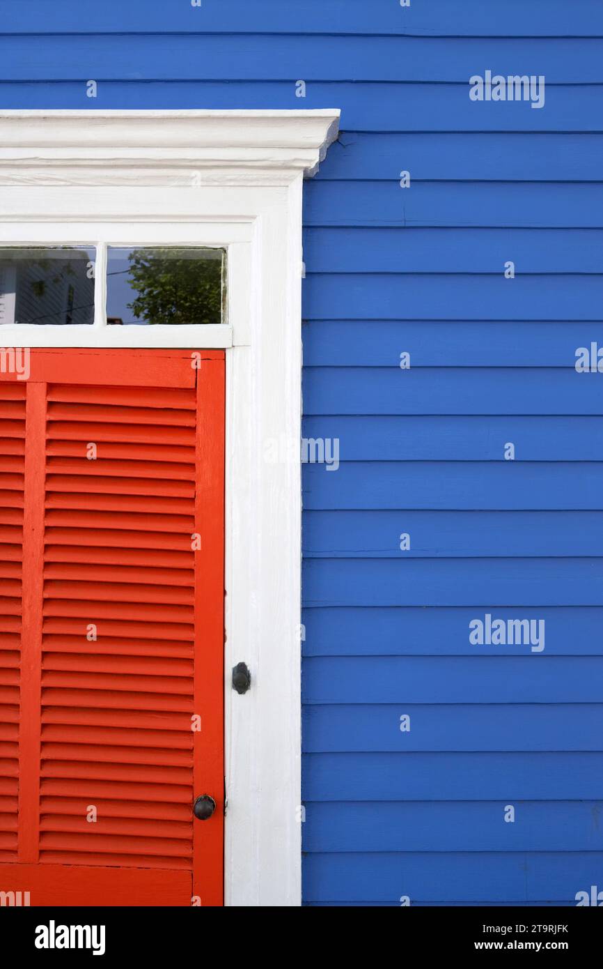 A blue house with bright orange shutters in Stonington, CT Stock Photo ...