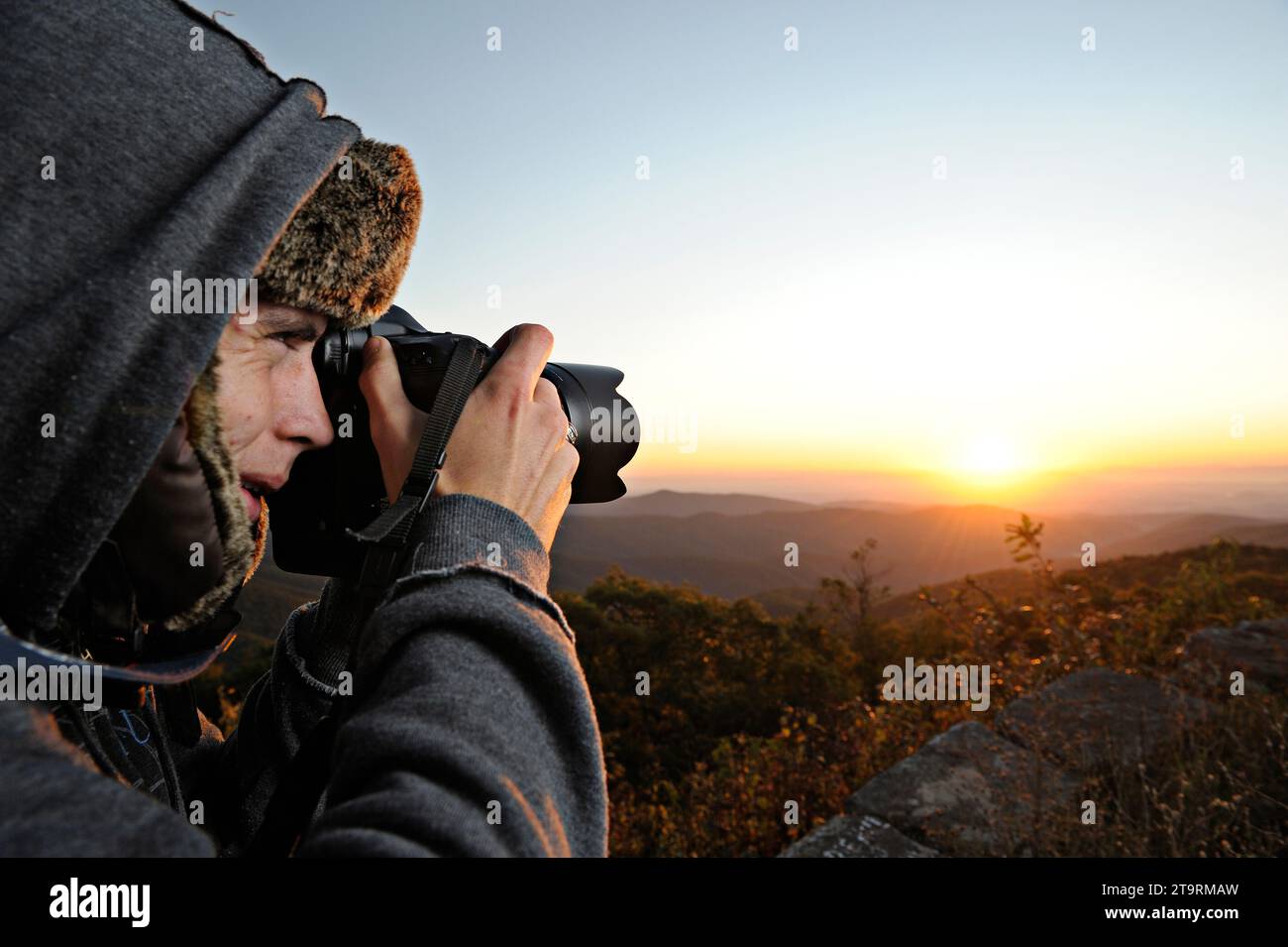 A man wearing a hat and hood takes a picture at Bird Knob - Shenandoah ...
