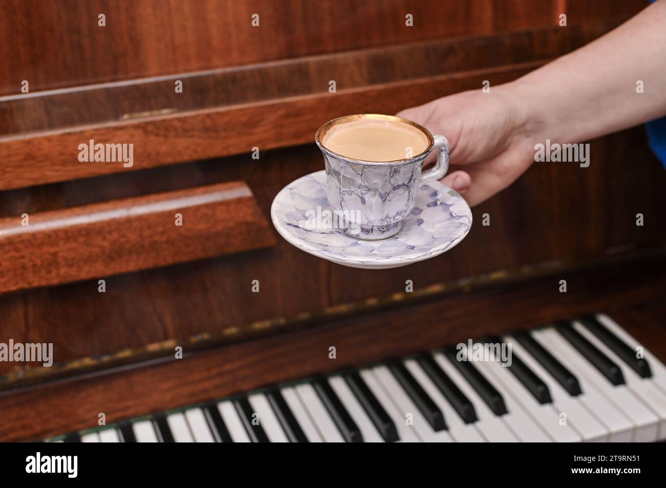 the concept of a musical pause during music lessons. A cup of coffee in ...
