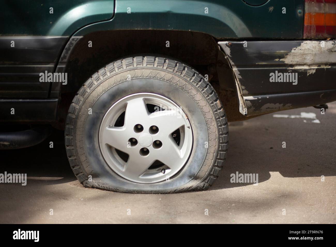 Old deflated rubber tire hi-res stock photography and images - Alamy