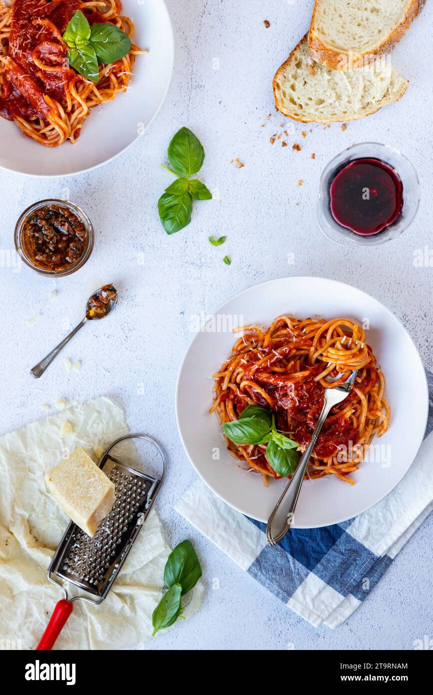 Two spaghettis bowls on a table Stock Photo - Alamy