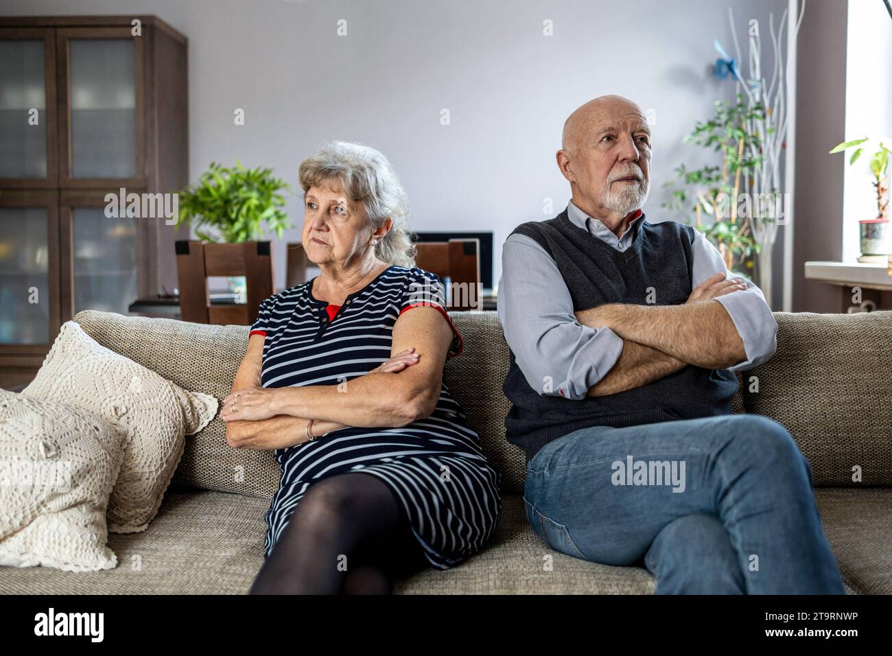 Old couple sitting on sofa hi-res stock photography and images - Alamy