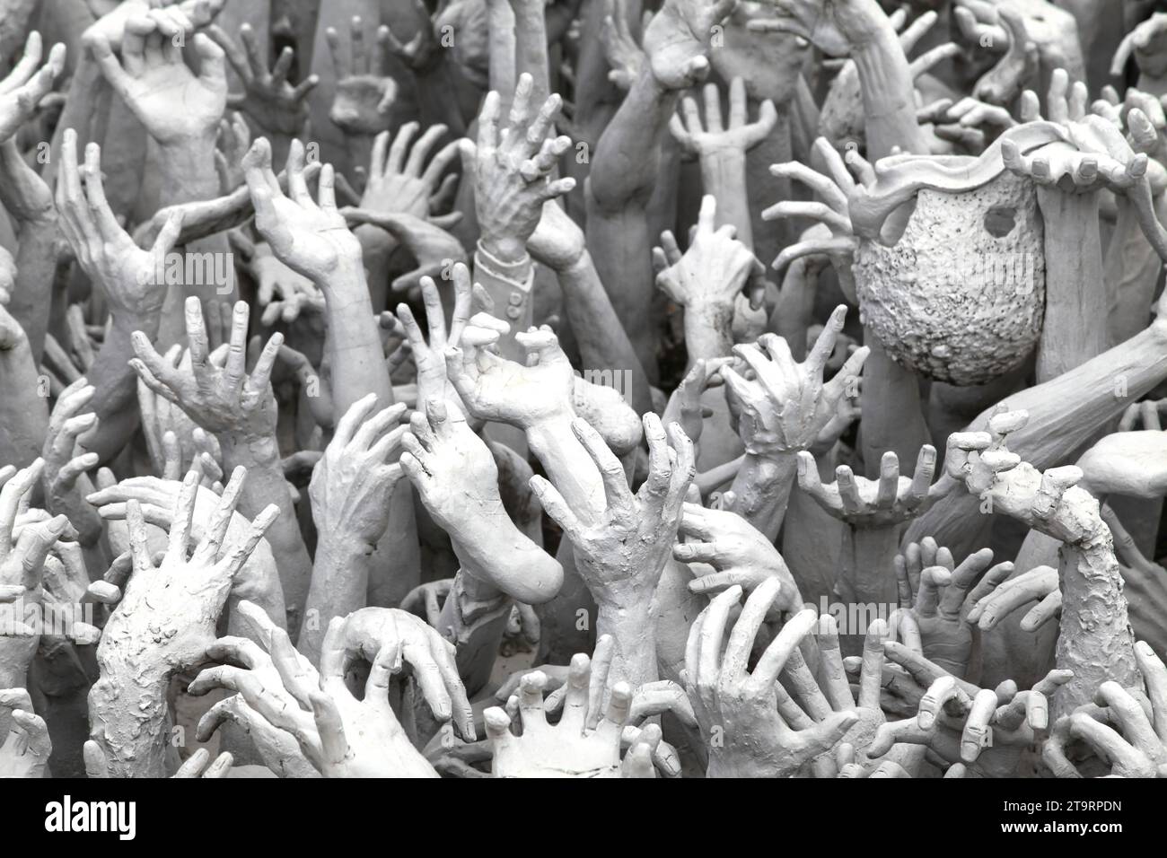 Thousand of hands raising from hell at Wat Rong Khun in Chiang Rai ...