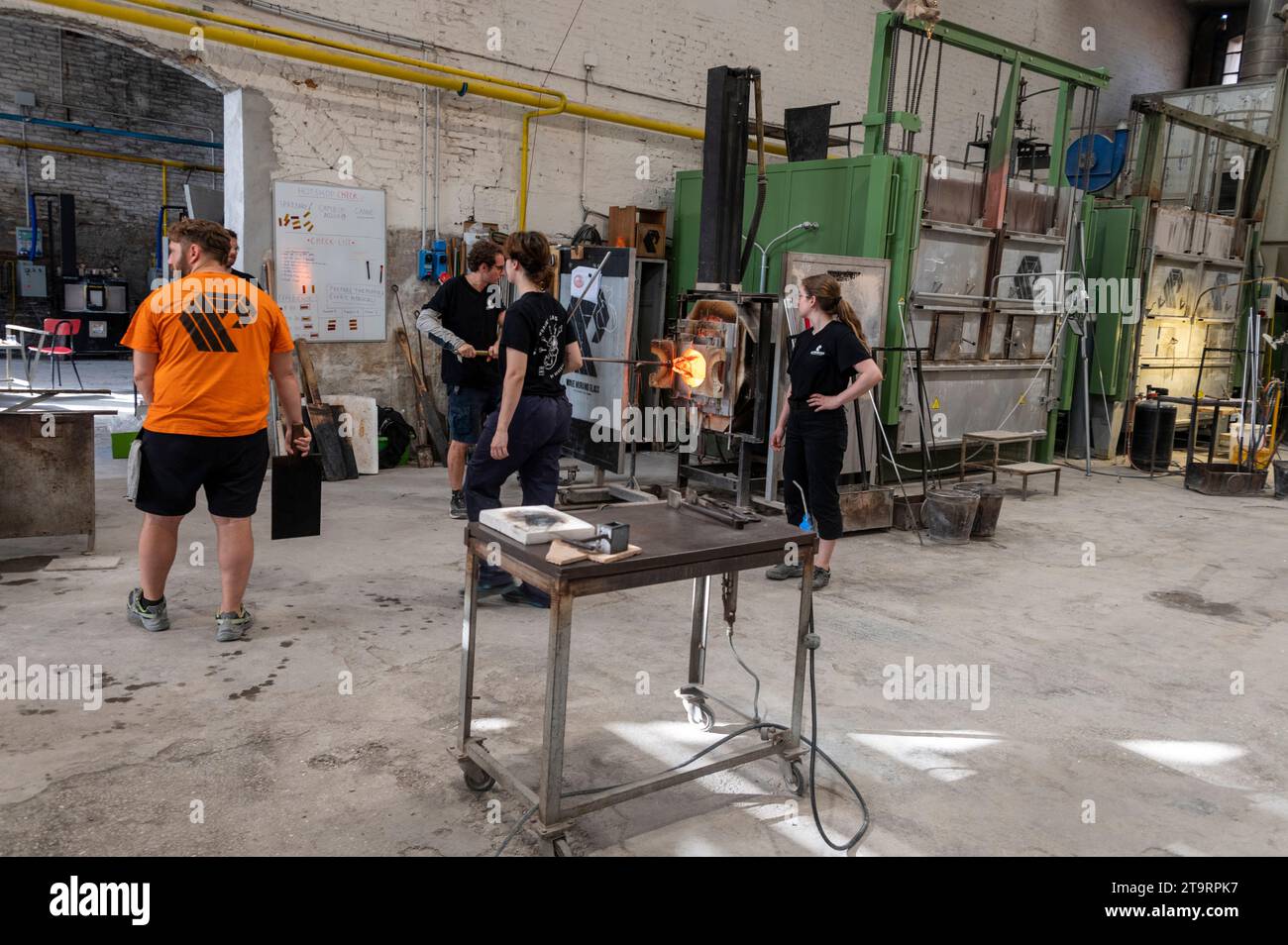 In the glassblowing studio with furnaces at the Wave Murano Glass ...