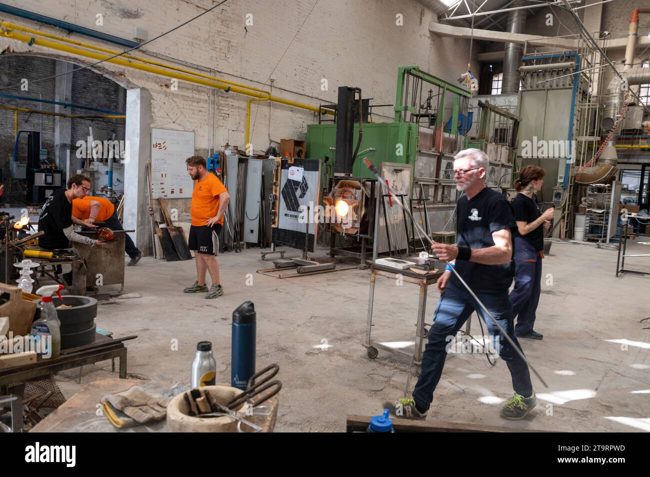 In the glassblowing studio with furnaces at the Wave Murano Glass ...