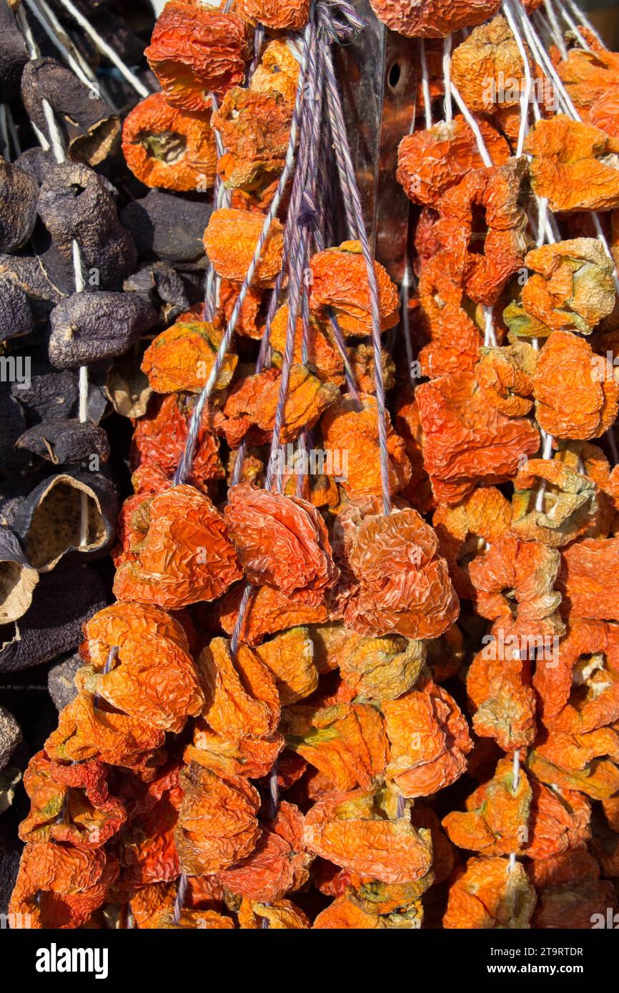 Bundles of red peppers dry in the sun Stock Photo - Alamy
