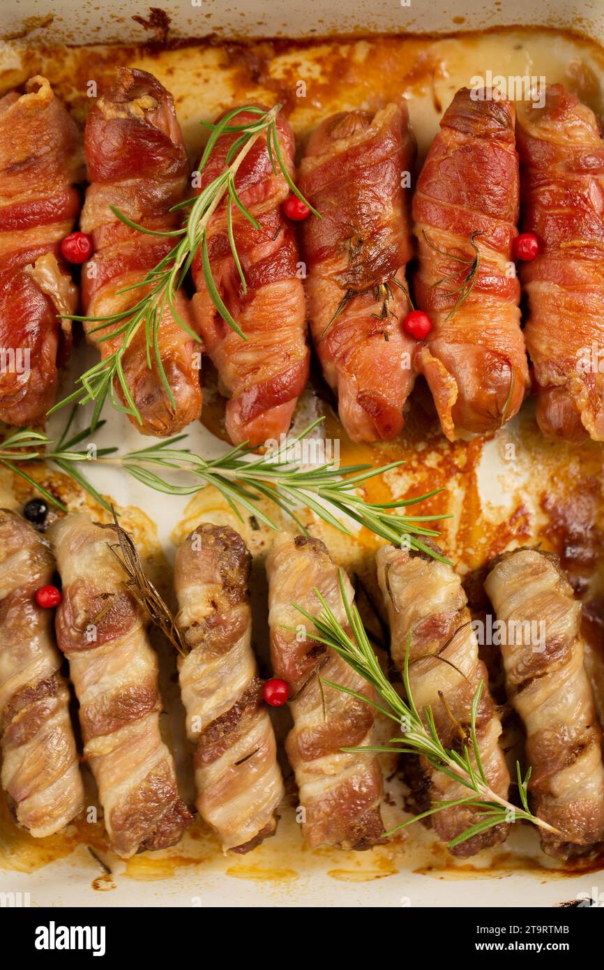 Traditional Christmas dish "Pigs in a blanket" Sausages wrapped in ...