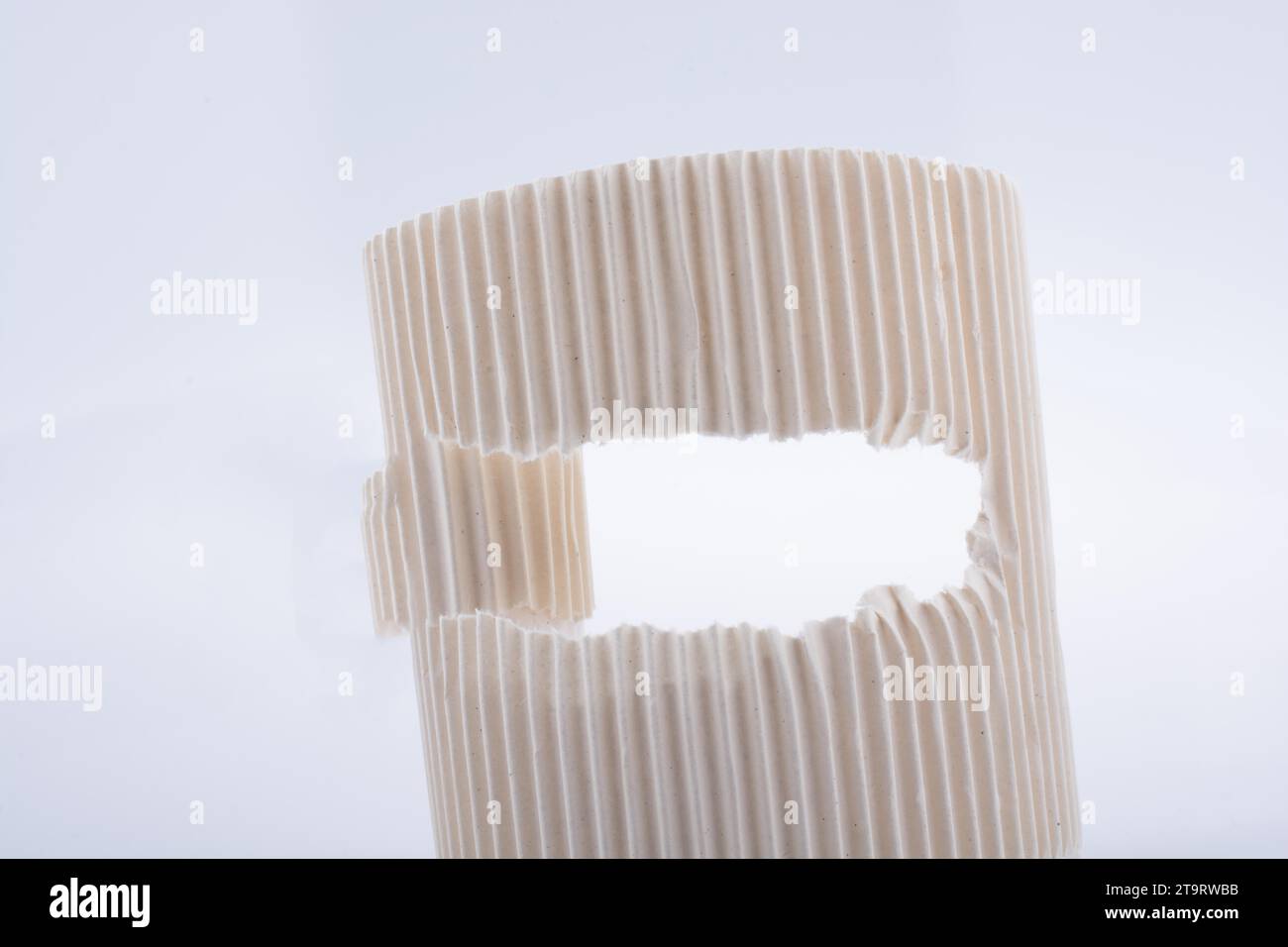 Rolled up torn paper on a white background Stock Photo - Alamy