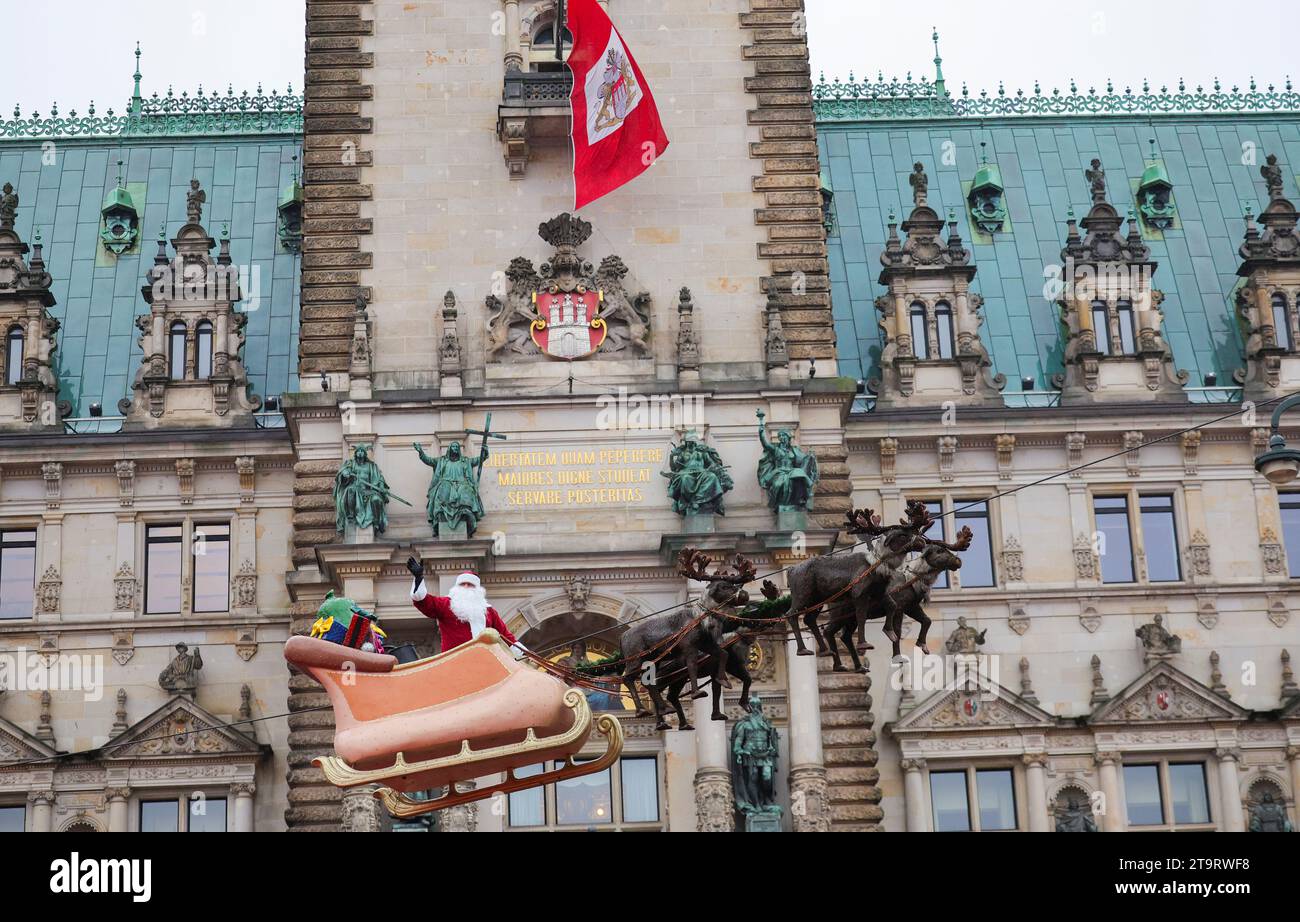 Hamburg, Germany. 27th Nov, 2023. A Santa Claus in a flying reindeer ...