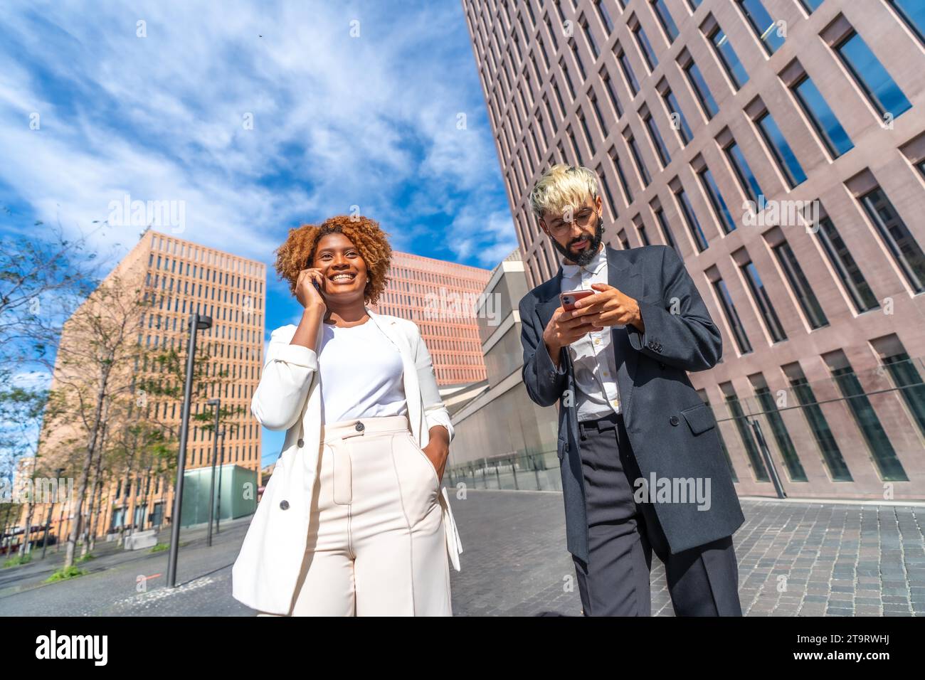 Low angle view portrait of multi-ethnic business people using phone ...