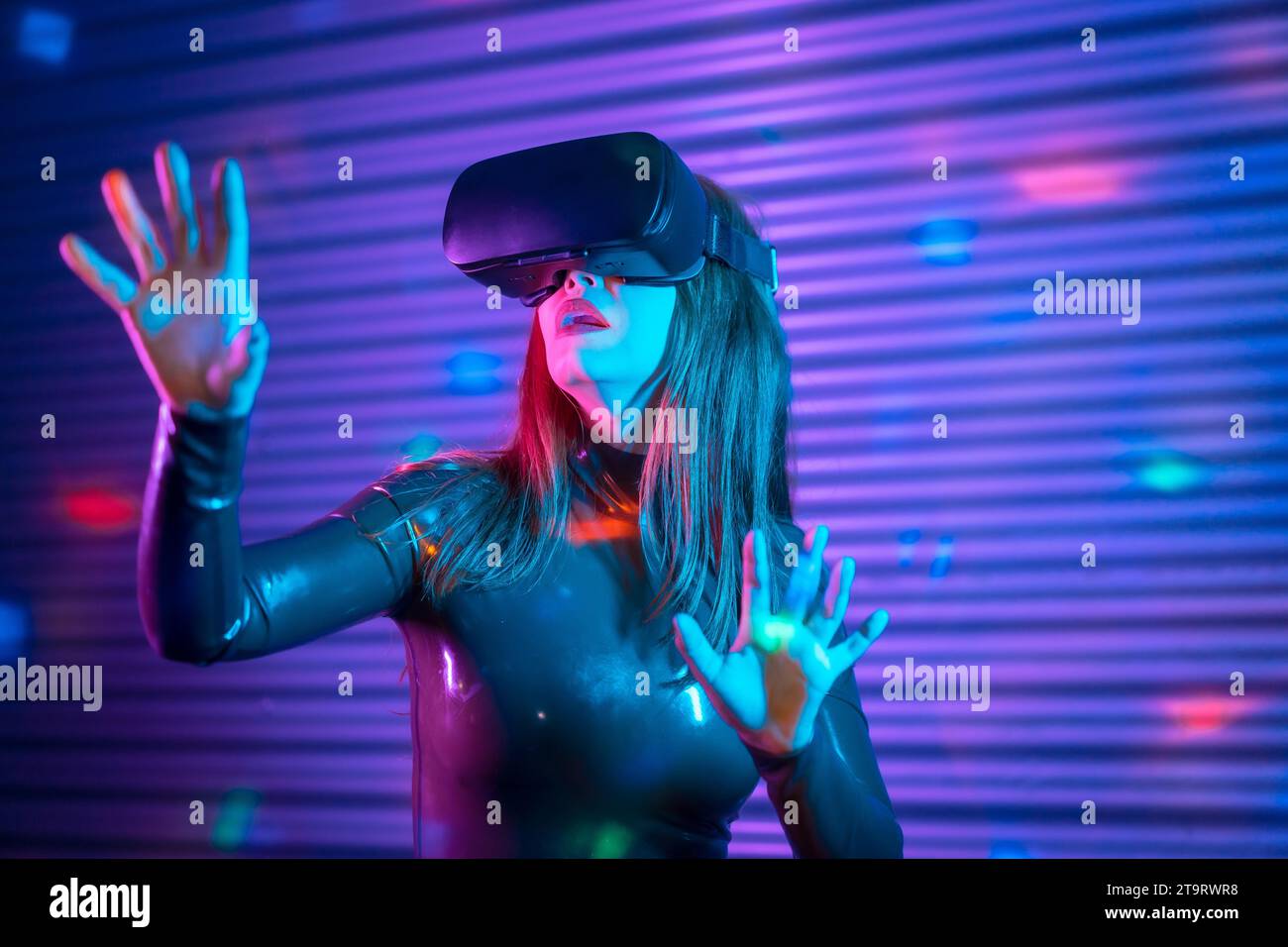 Female gamer wearing augmented reality goggles in a futuristic space ...