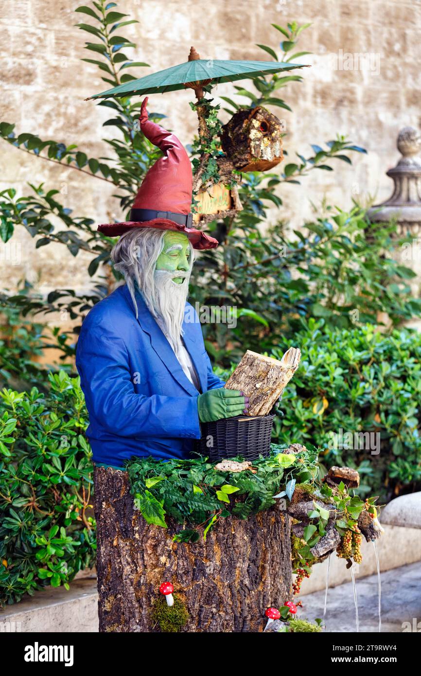 Street performer, mime, living statue of an elf, leprechaun, El Duende ...