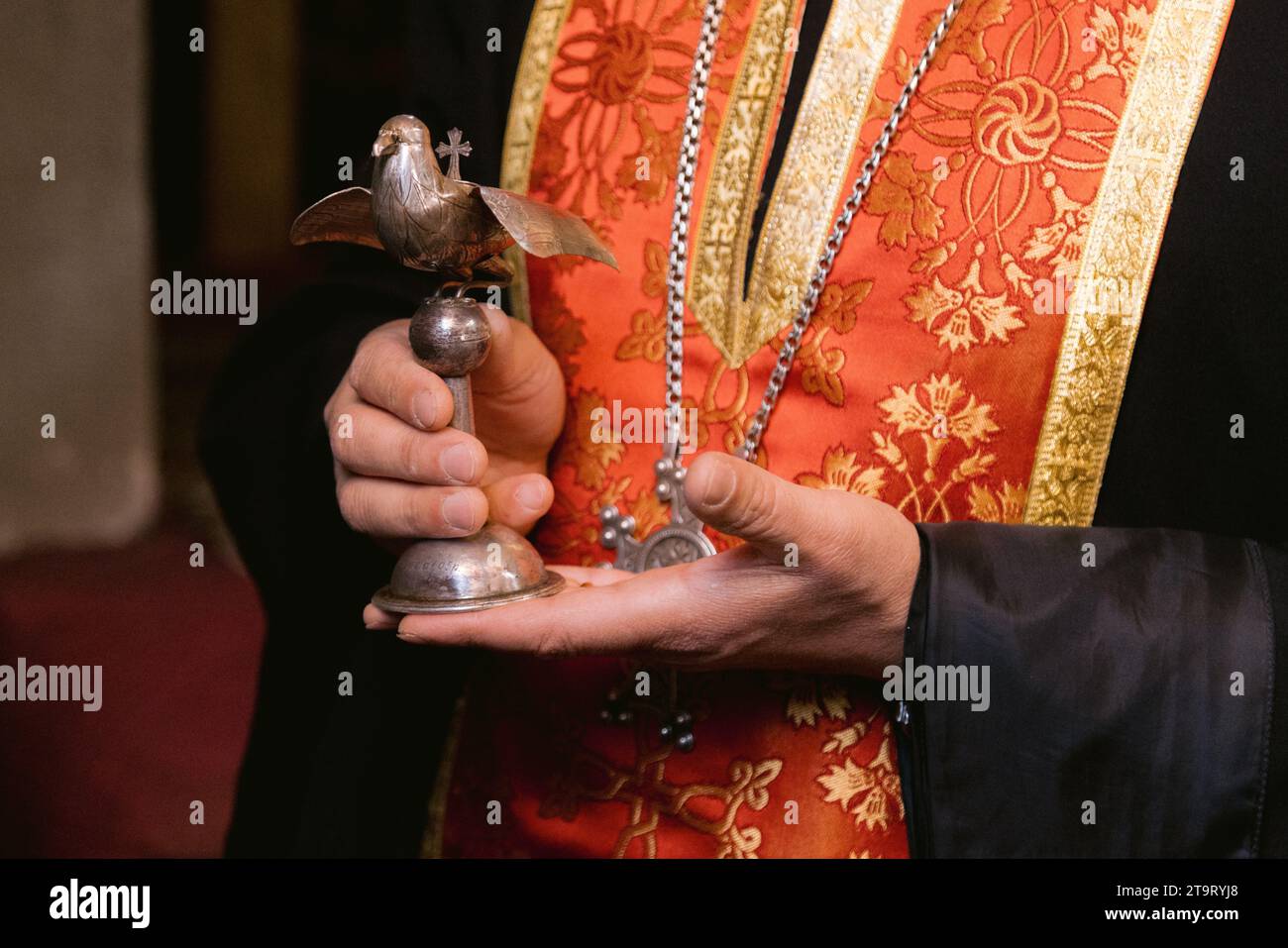 The priest holding a bird-shaped vessel containing myron. Armenian ...