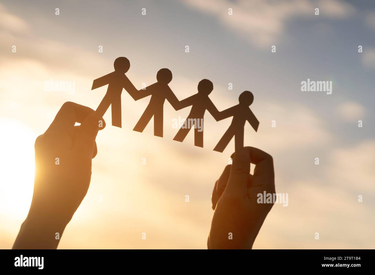 Teamwork and relations. symbolic of paper chains in woman's hand ...
