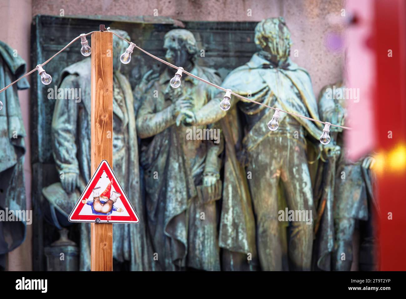 caution danger of slipping sign with Heinzelmaennchen in front of the ...