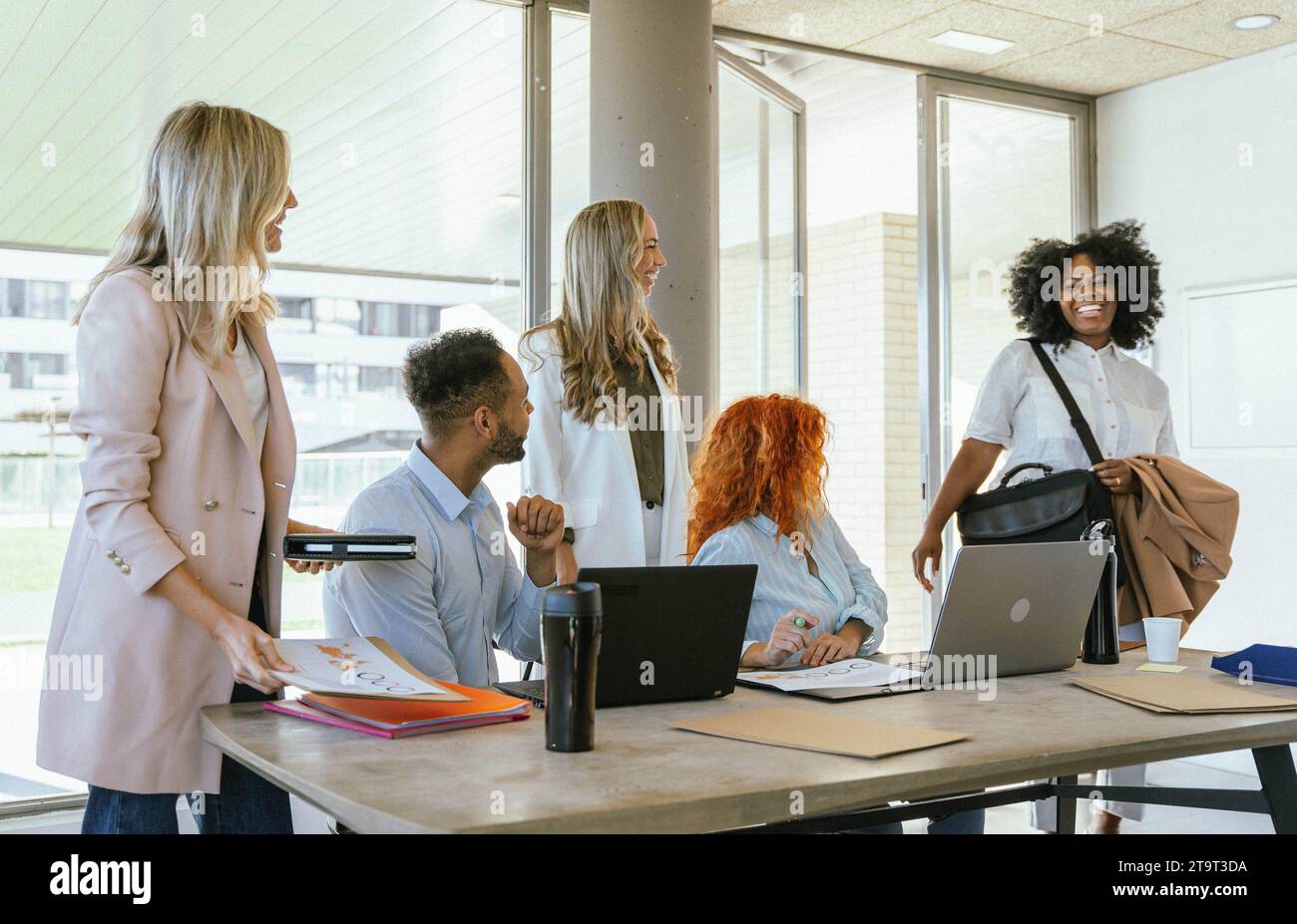 Businesswoman smiling while entering the office to work. Business ...