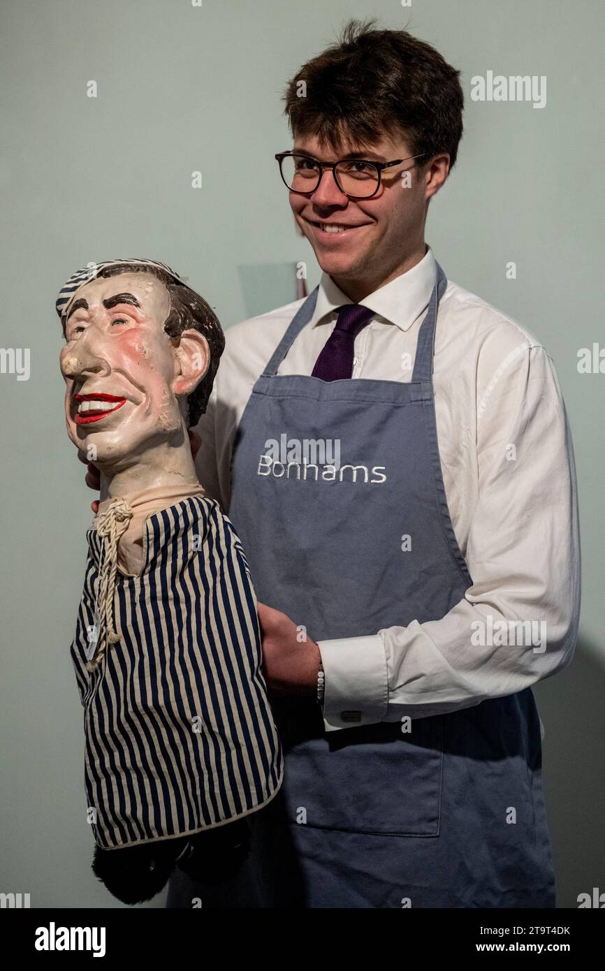 London, UK. 27 November 2023. A technician with a ‘Hand puppet of ...