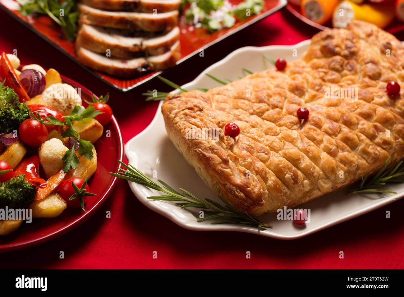 Traditional festive Christmas dishes on the table. Wellington with ...