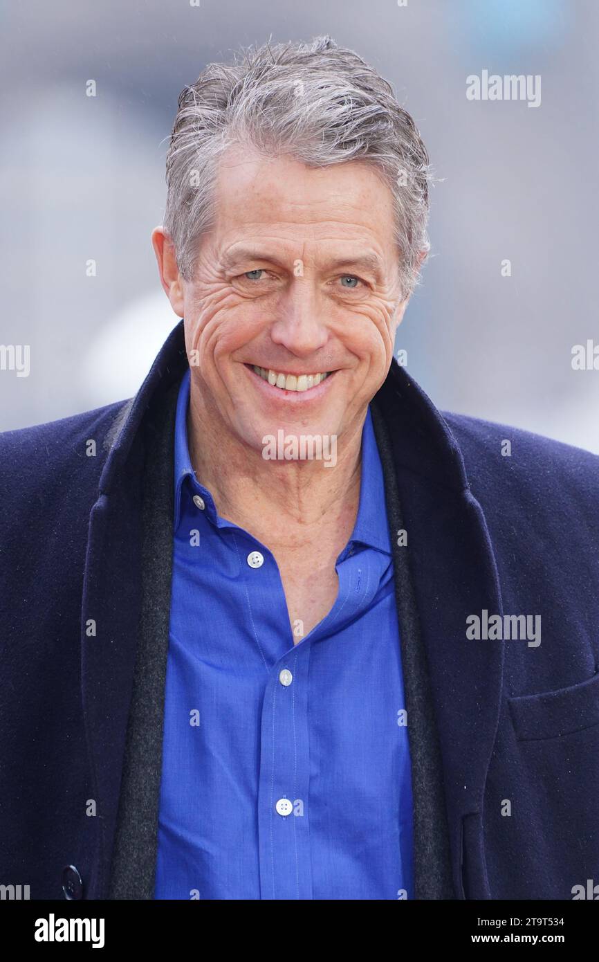 Hugh Grant during a photo call with the cast of Wonka at Potter's Field ...