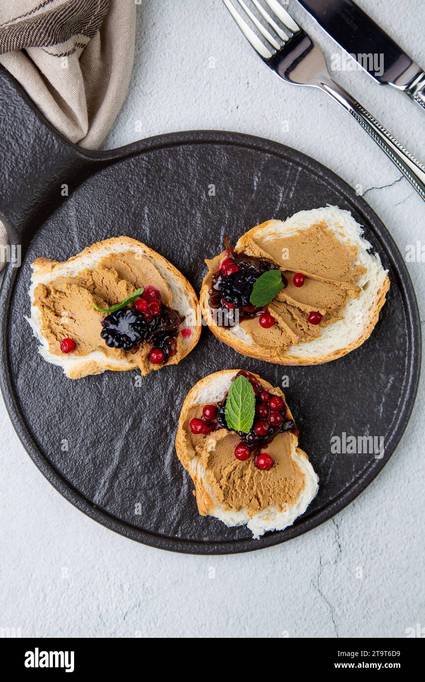 canapes with pate, mint leaves and berries, top view Stock Photo - Alamy
