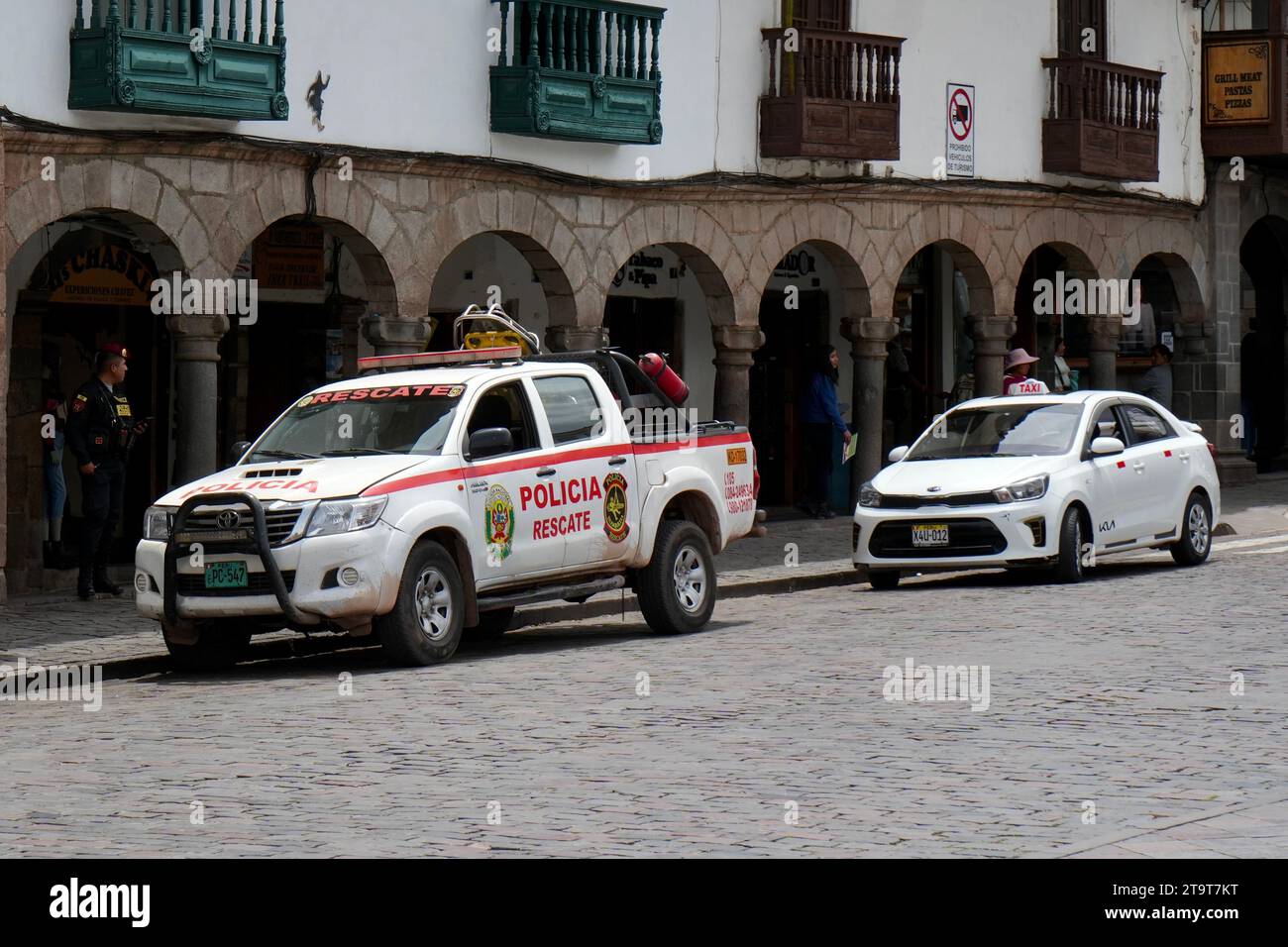Police Rescue Vehicle and a Taxi in Plaza Mayor de Cusco (Cusco Main ...