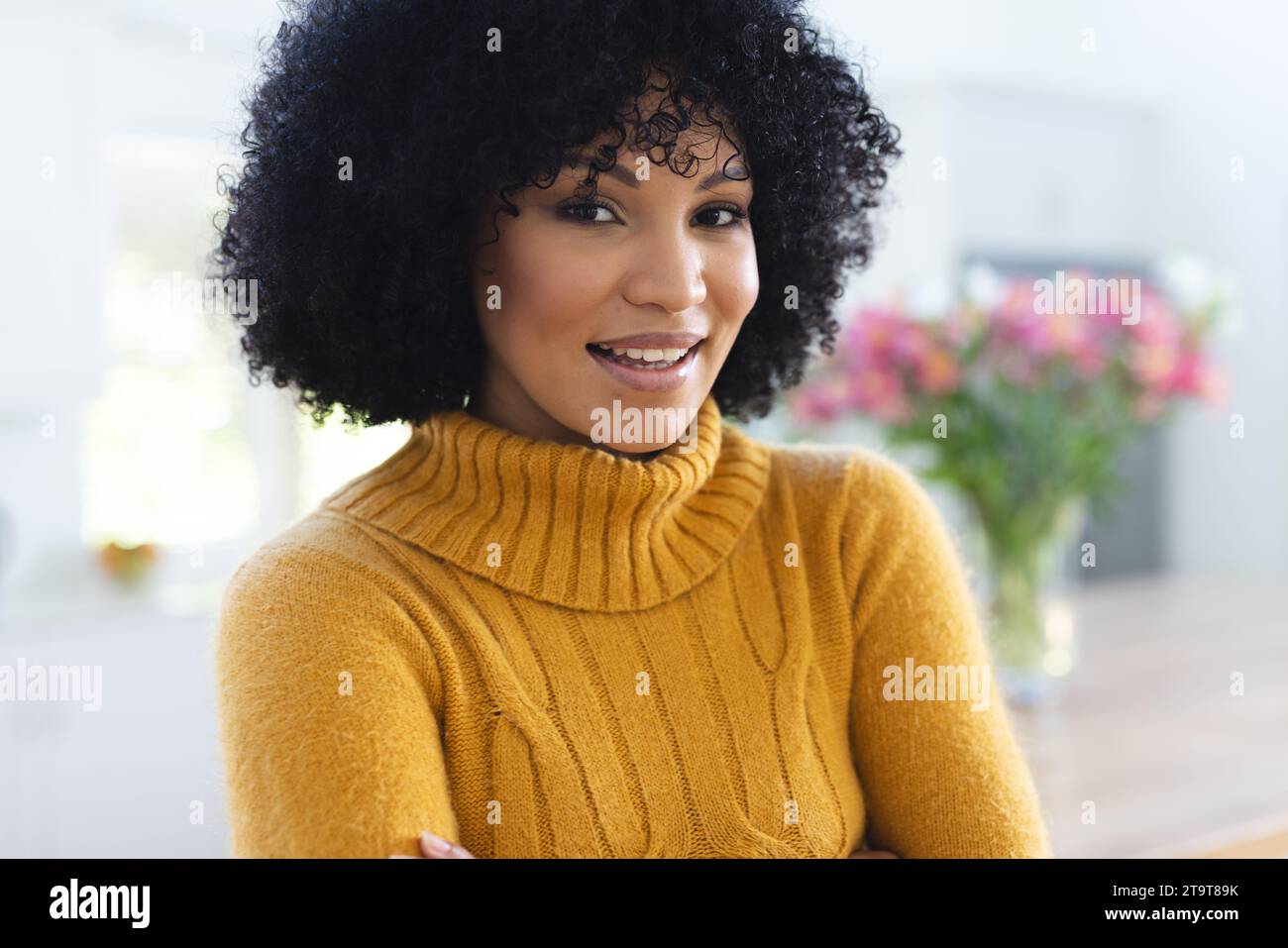 Happy african american woman standing with arms crossed at home, copy ...