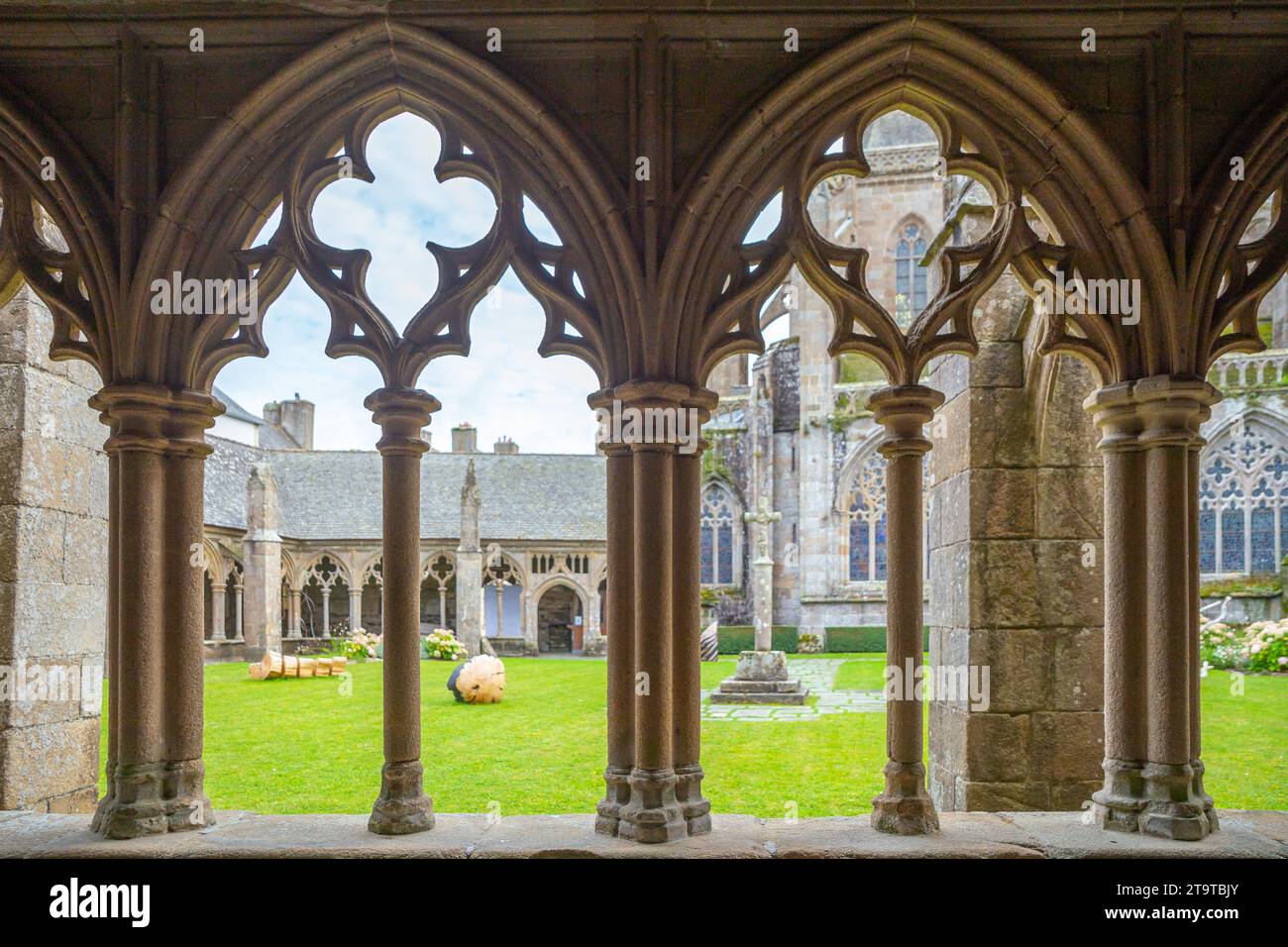 Watch through cloister in Cloître de la cathédrale, Tréguier, France ...