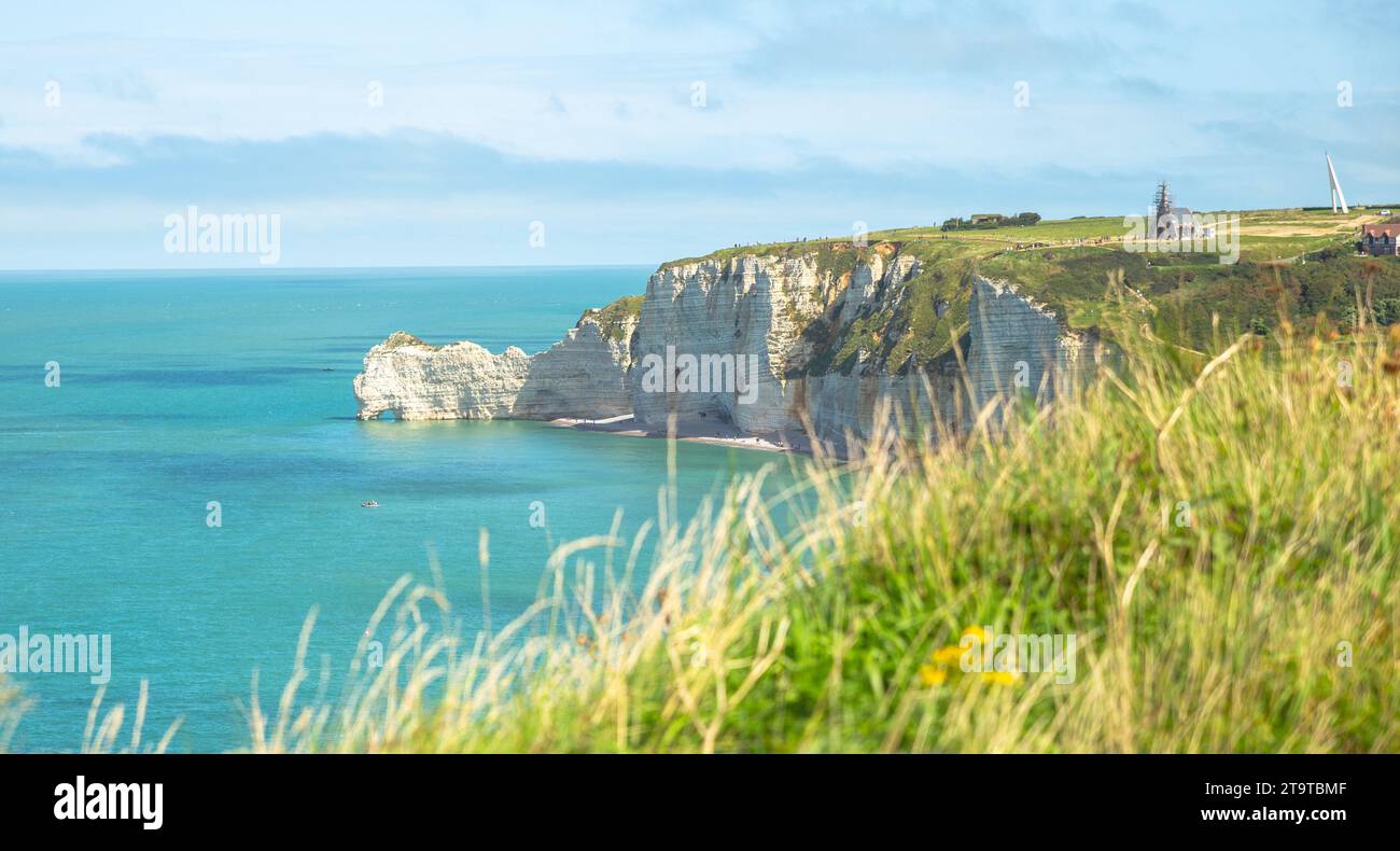 white towering sea cliff in the distance in Étretat Stock Photo - Alamy