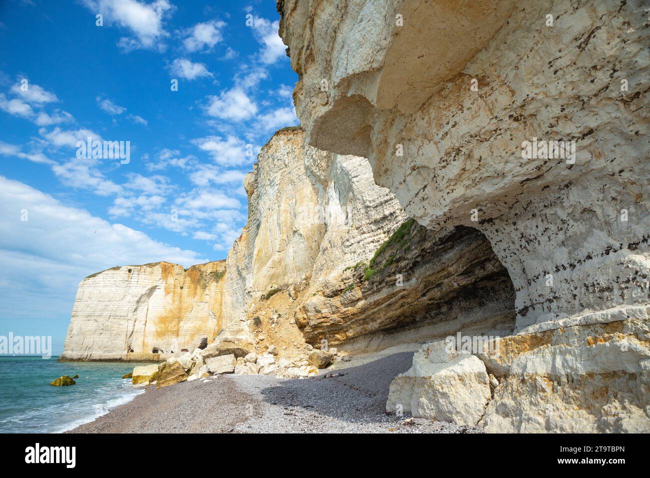 look up angel of the white towering sea cliff with blue sky in Étretat ...