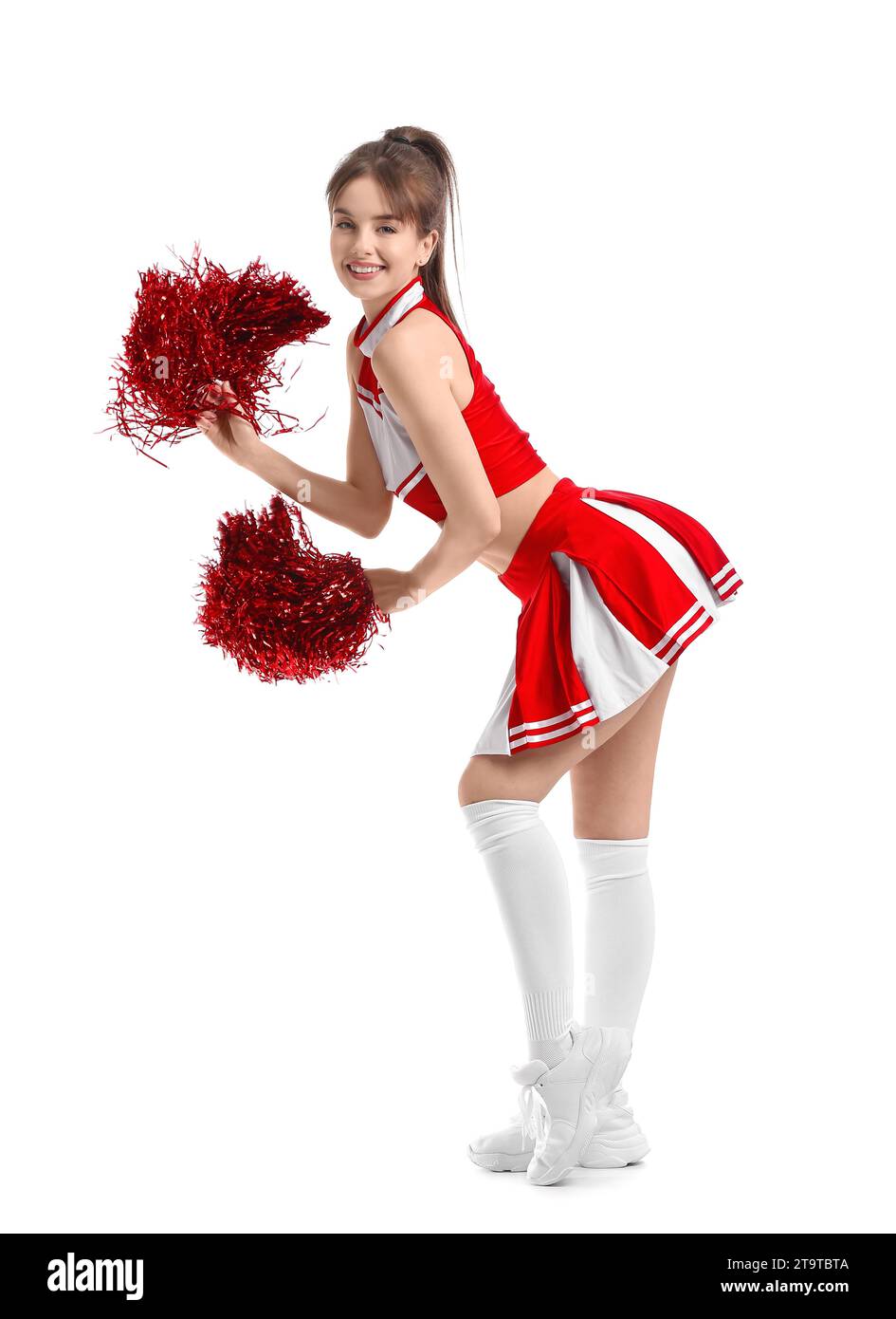 Beautiful young cheerleader on white background Stock Photo - Alamy