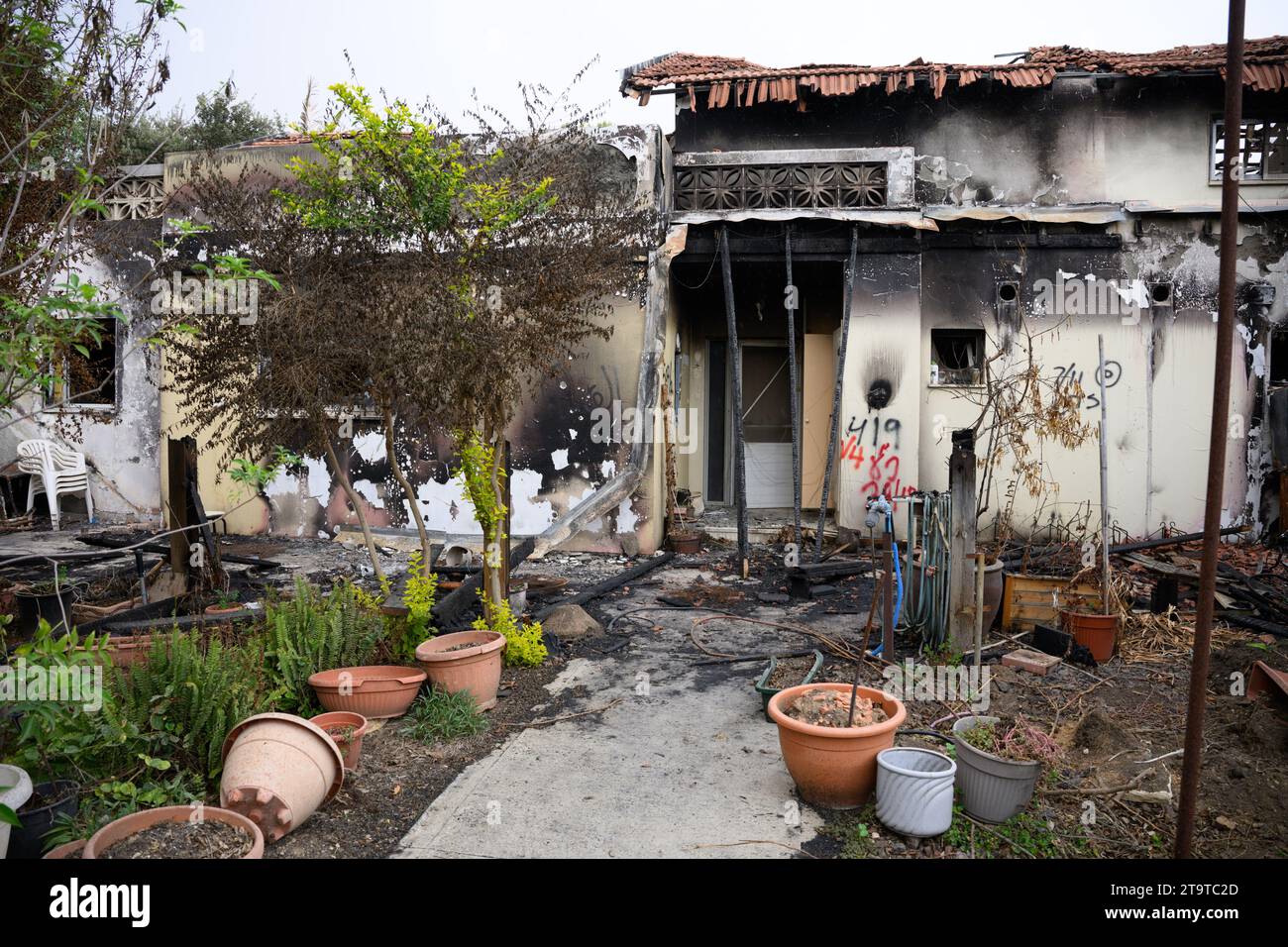 Beeri, Israel. 27th Nov, 2023. Rubble lies in front of a destroyed ...