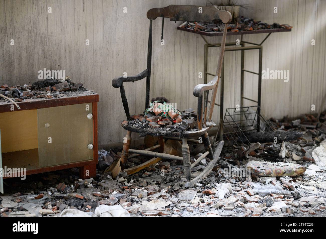 Beeri, Israel. 27th Nov, 2023. A doll lies on a rocking chair in a ...