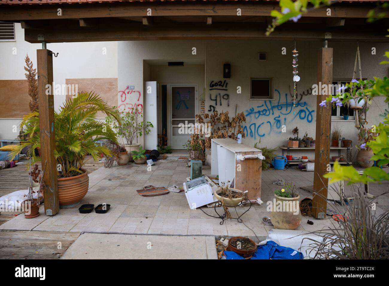 Beeri, Israel. 27th Nov, 2023. Rubble lies in front of a destroyed ...