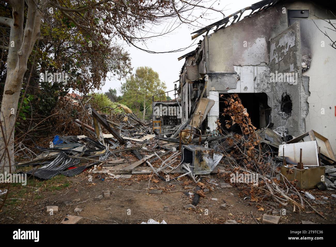 Beeri, Israel. 27th Nov, 2023. Rubble lies in front of a destroyed ...