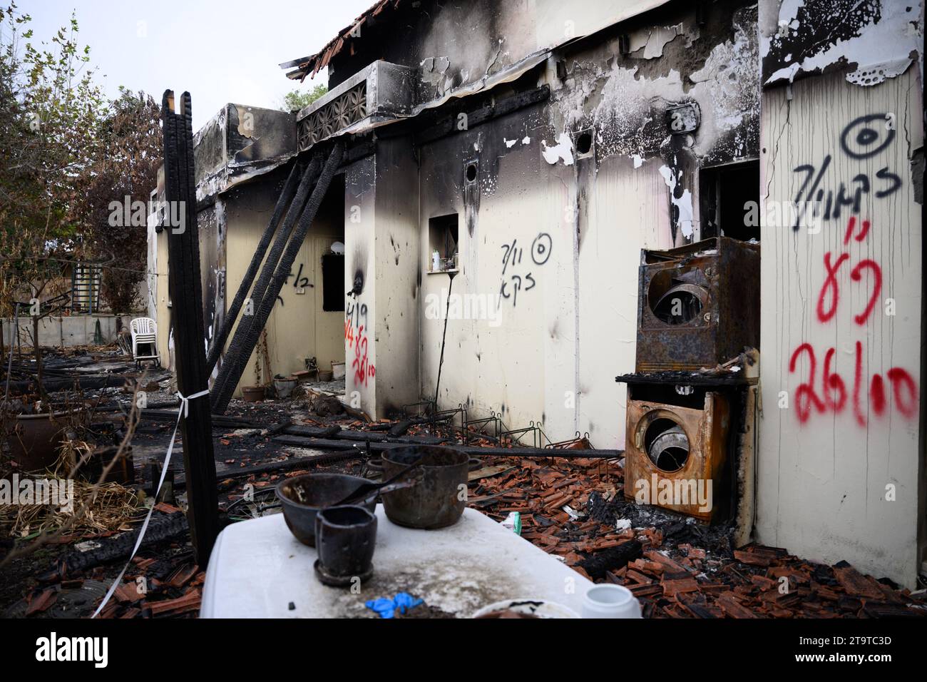 Beeri, Israel. 27th Nov, 2023. Rubble lies in front of the destroyed ...