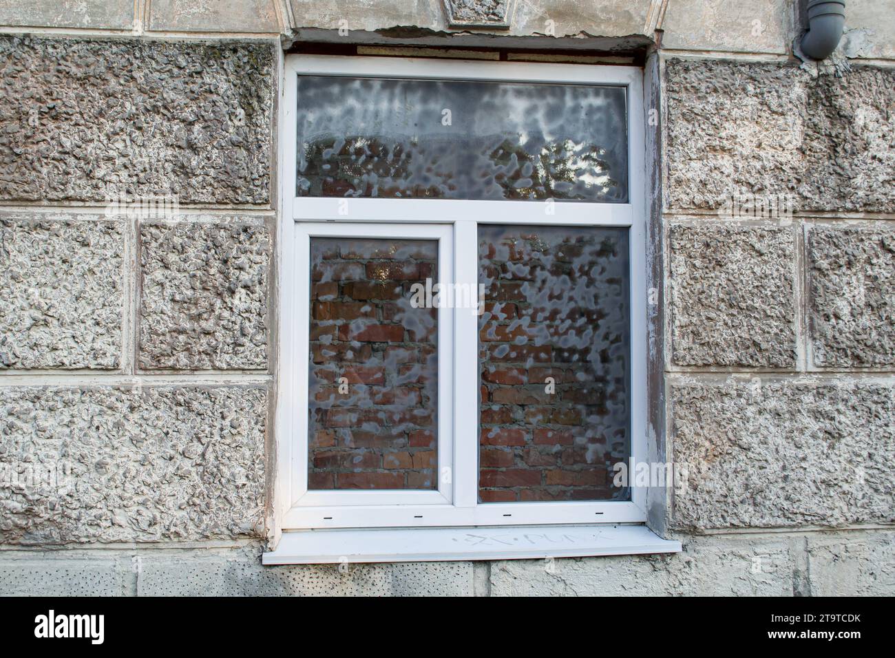 Newly installed window with a brick wall behind it Stock Photo - Alamy
