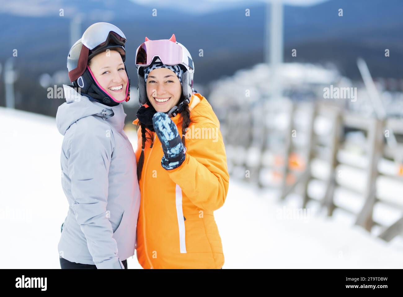 Two beautiful ski girls posing outdoors. Skier friends having fun Stock ...
