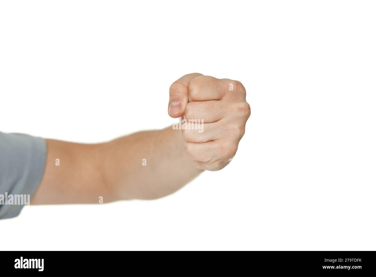 Male clenched fist holding white Cut Out Stock Images & Pictures - Alamy
