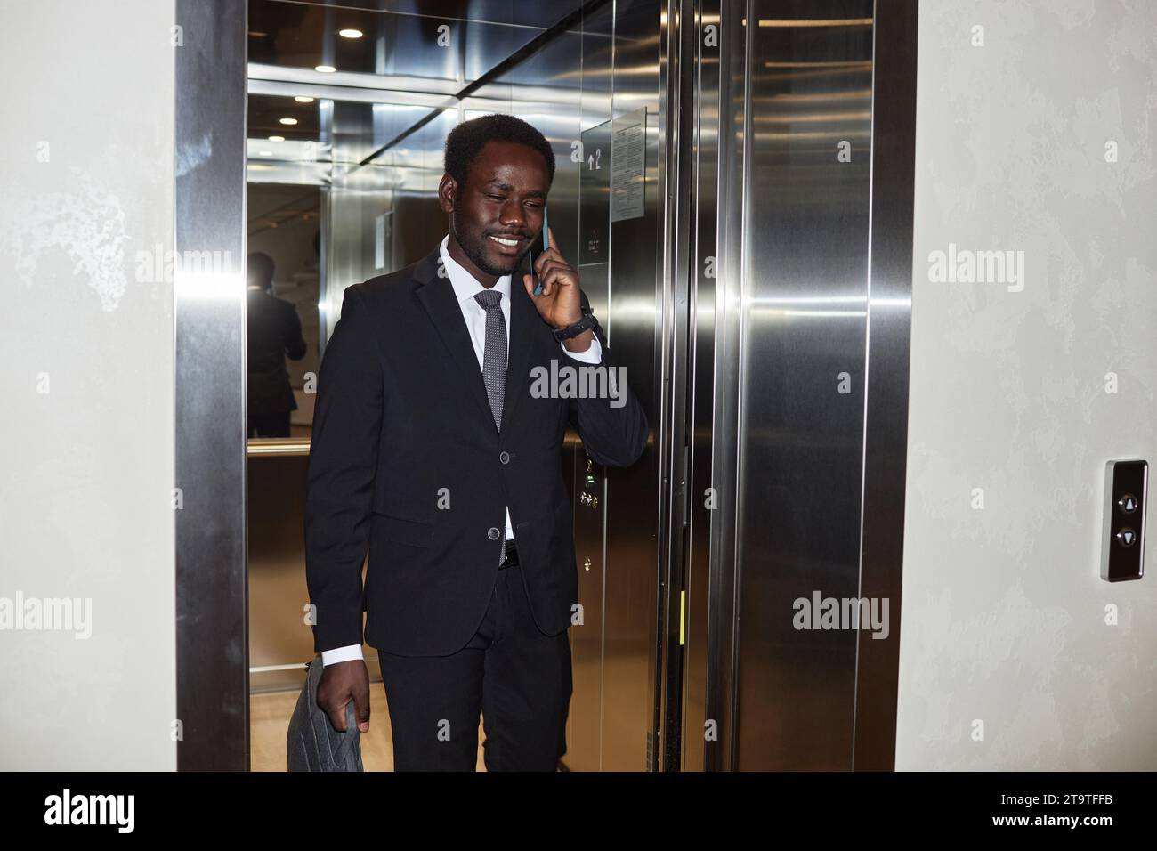 Medium full shot of smiling Black man wearing elegant business suit ...