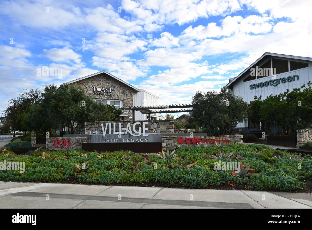 TUSTIN, CALIFORNIA - 16 NOV 2023: Sign and shops at The Village at Tustin Legacy Adjacent to the ...