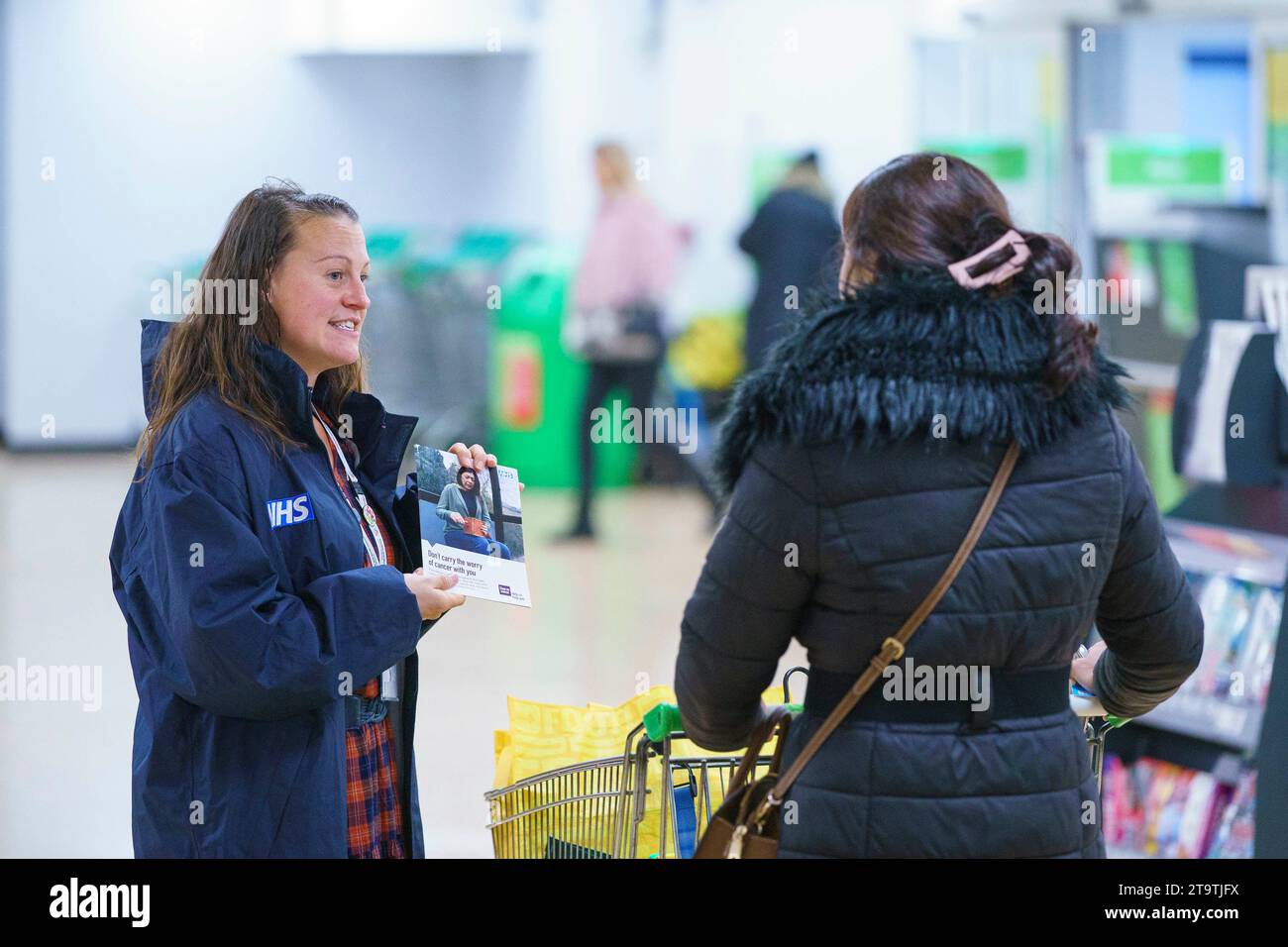 EDITORIAL USE ONLY Volunteers speak to members of the public as the ...