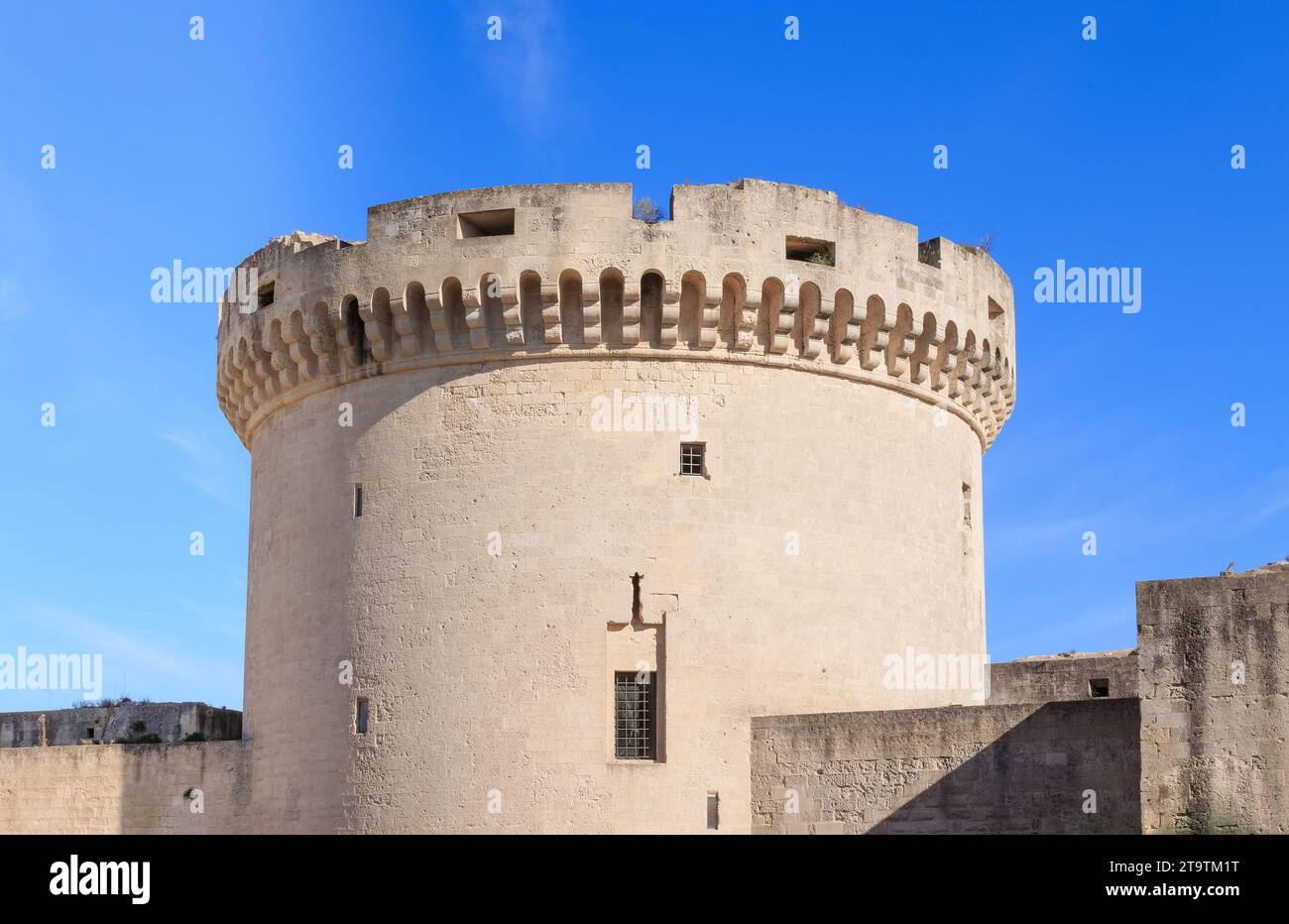 ruins of medieval old tower of castle under blue sky in Matera Italy ...