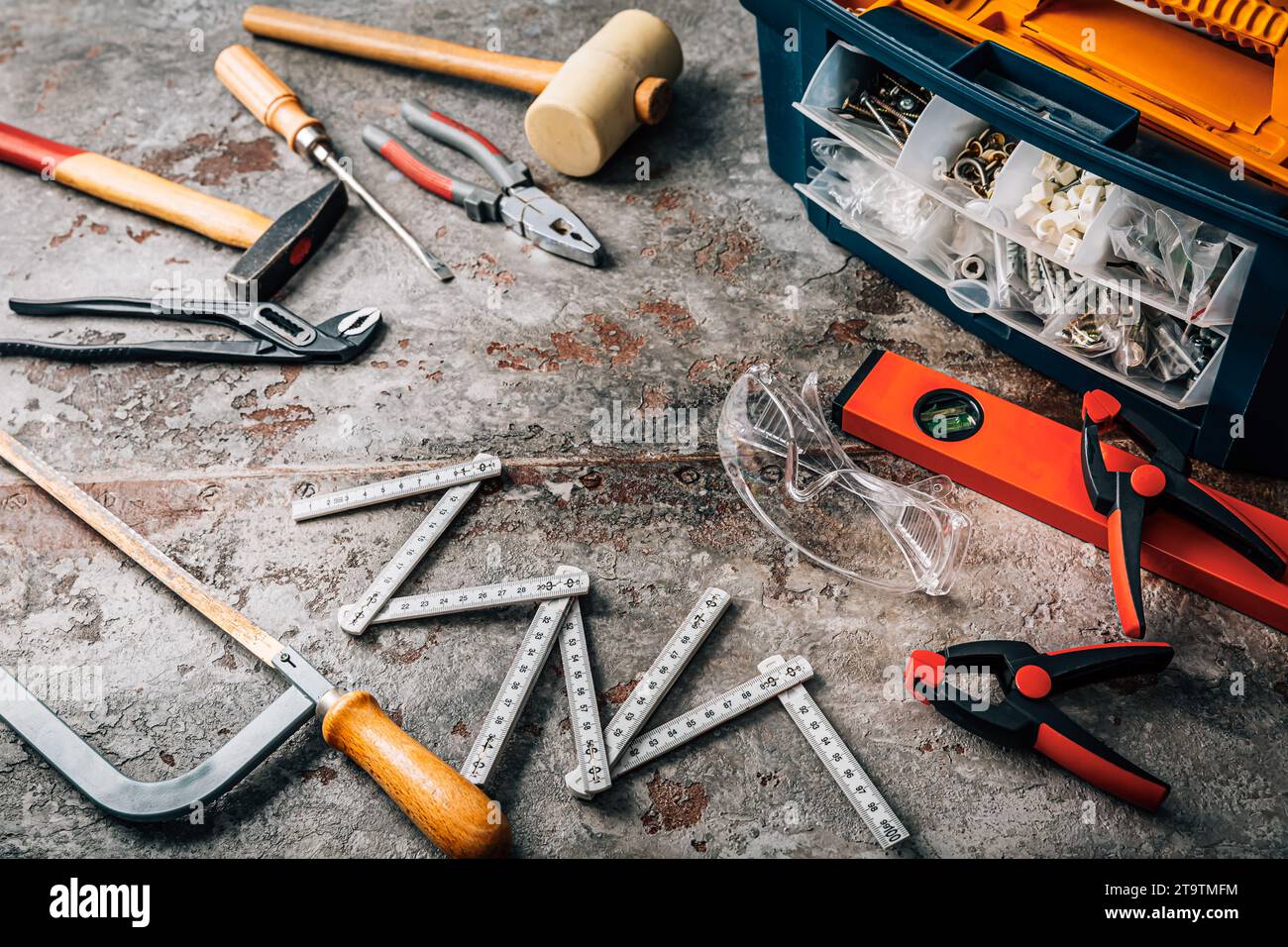 Handyman tool kit with assorted tools, gogles Stock Photo - Alamy