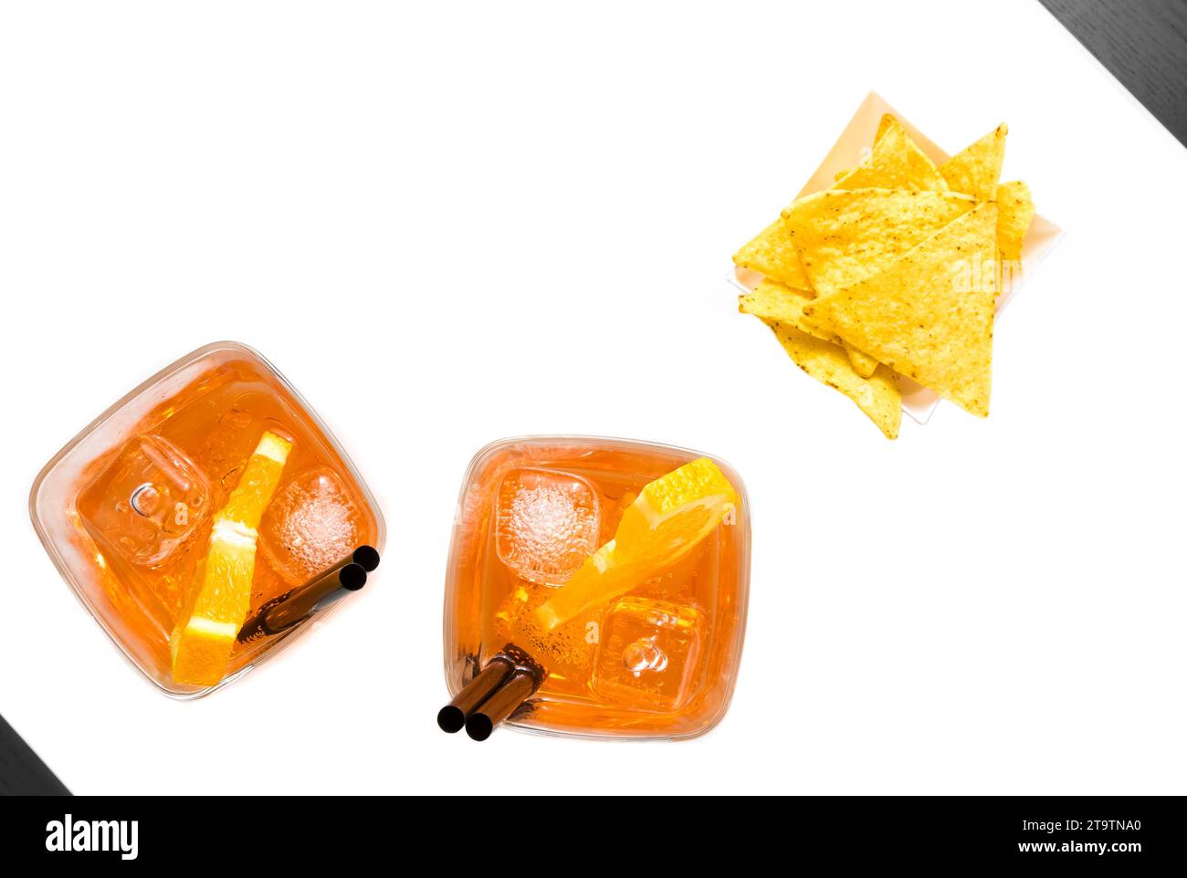 top of view of hot tacos chips near two glasses of spritz aperitif ...